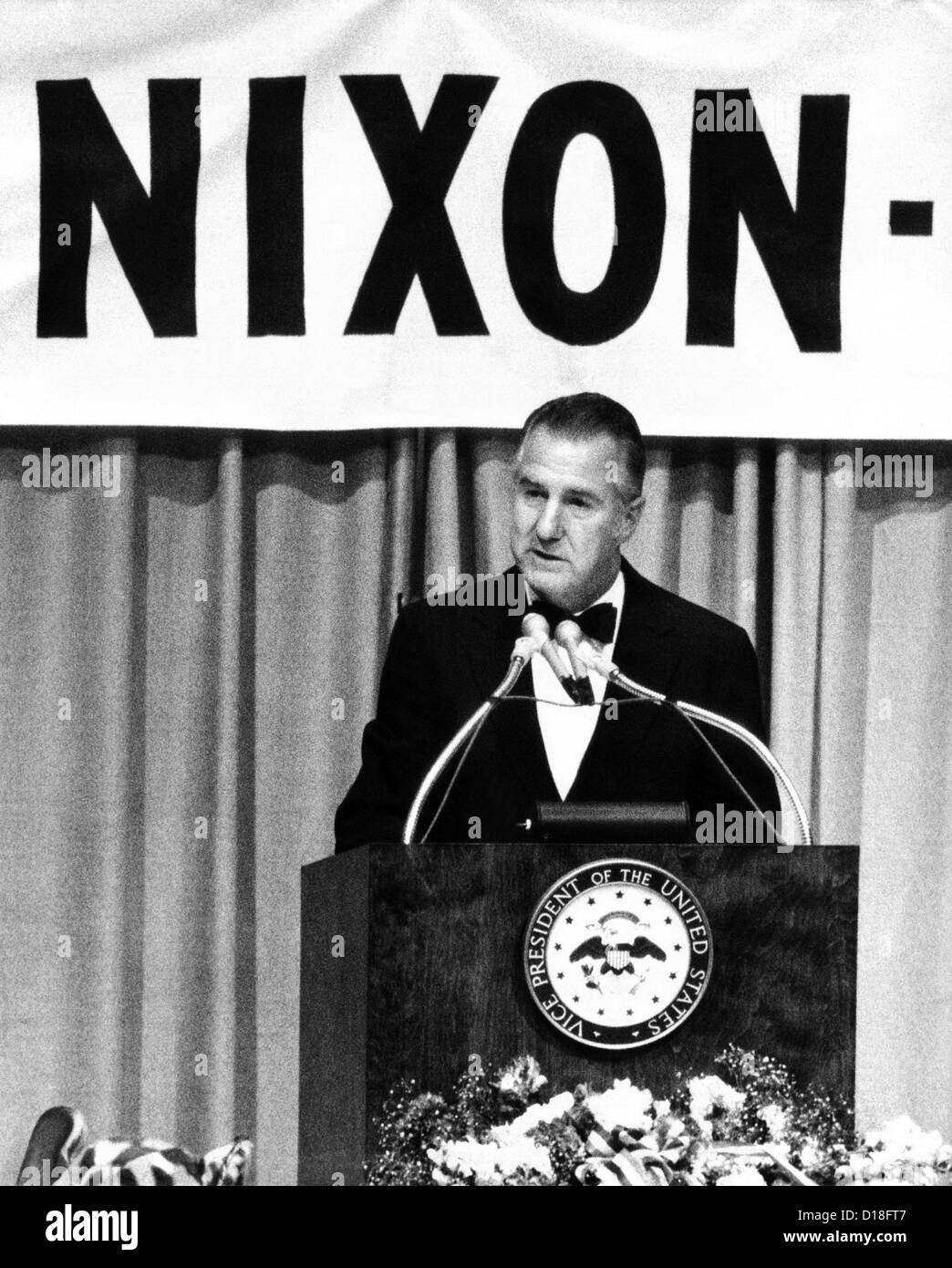 Spiro Agnew speaking in front of a large Nixon sign. He was at a $125 a ...