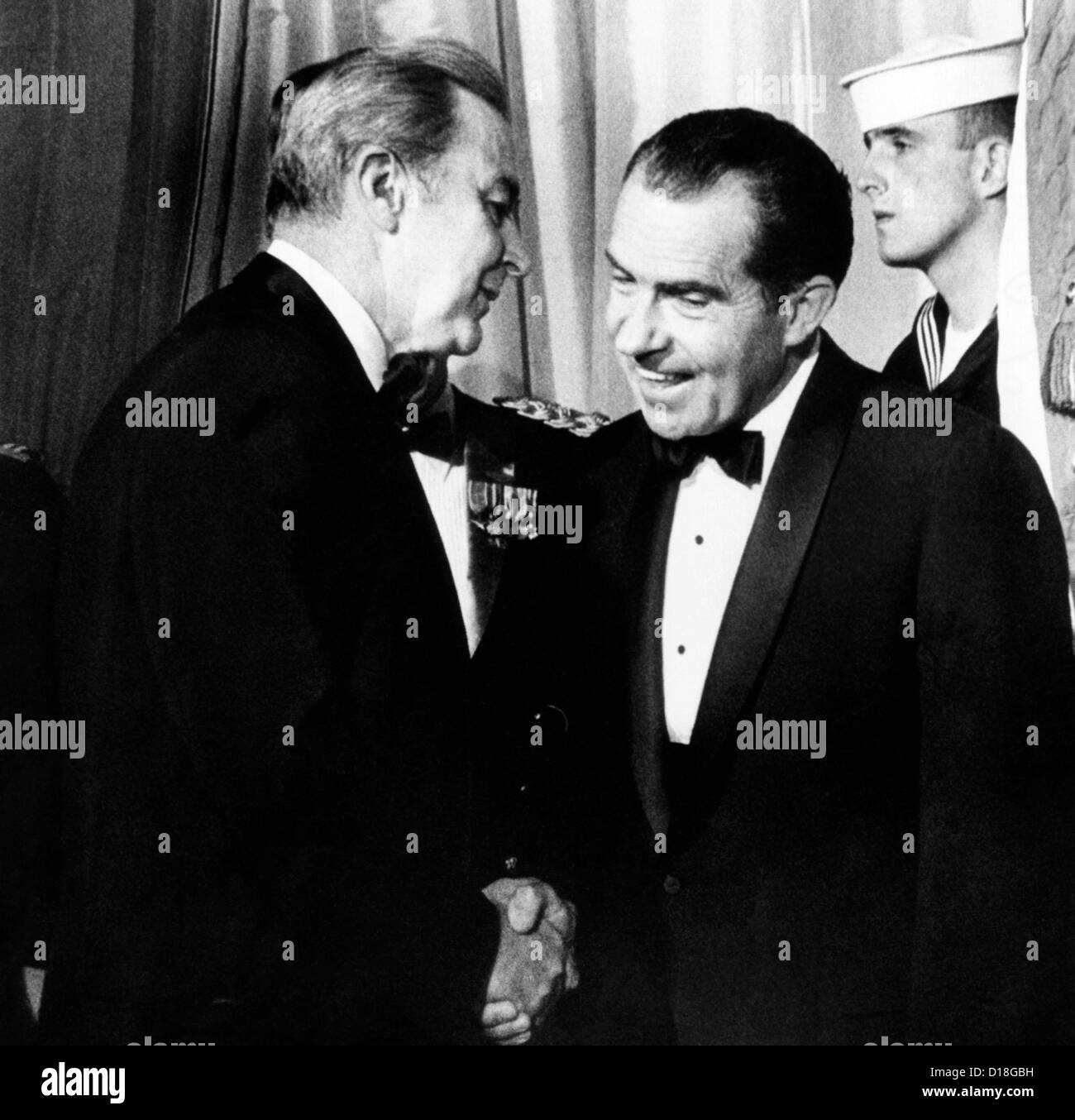 President Richard Nixon shakes hands with Sen. Eugene McCarthy at a ...