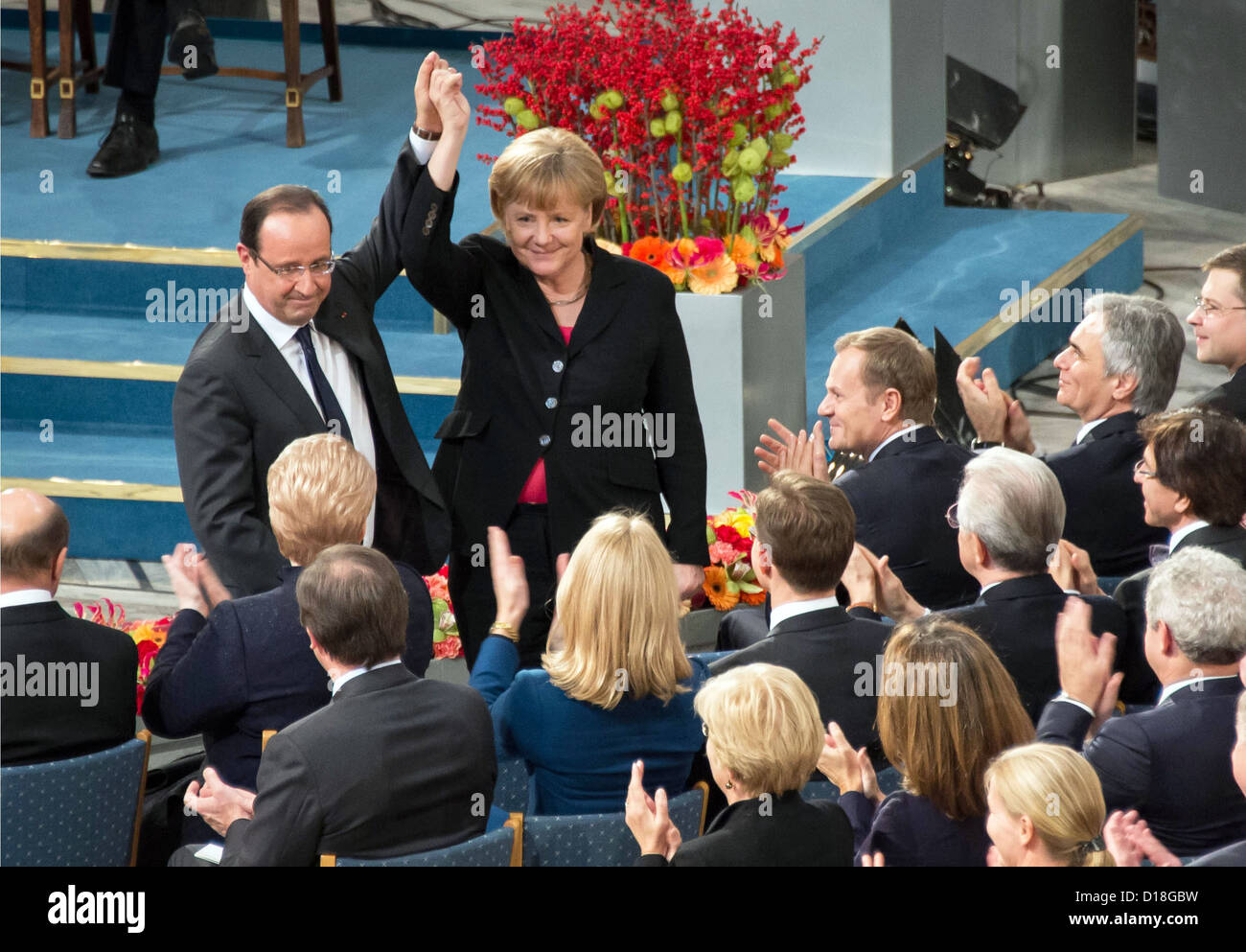A handout picture shows German chancellor Angela Merkel (r) and French ...
