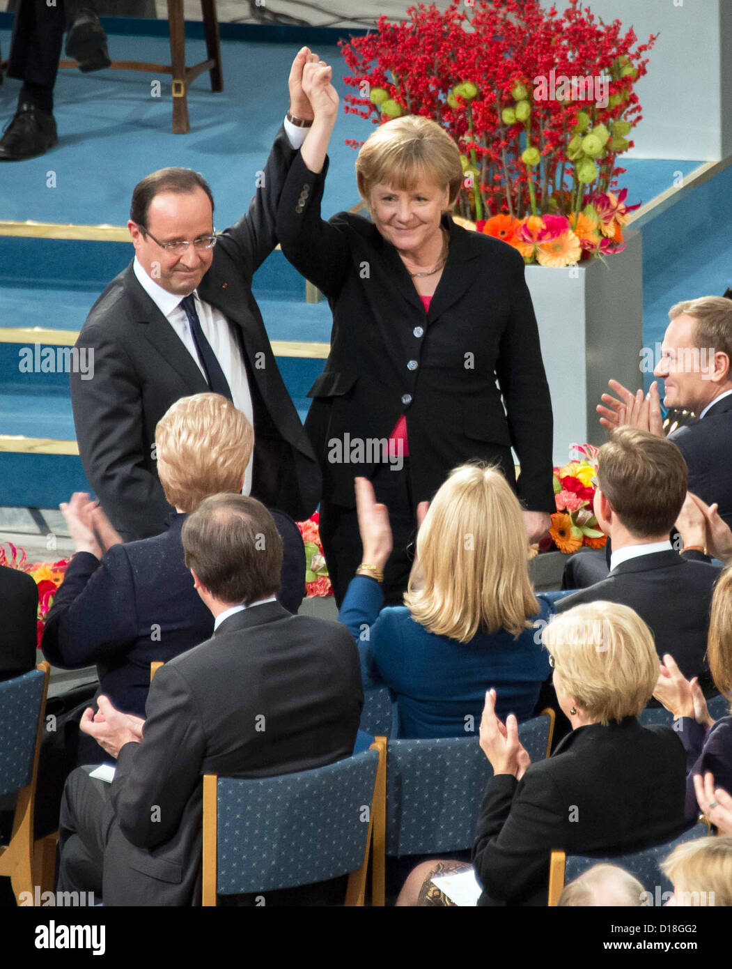 A handout picture shows German chancellor Angela Merkel (r) and French ...