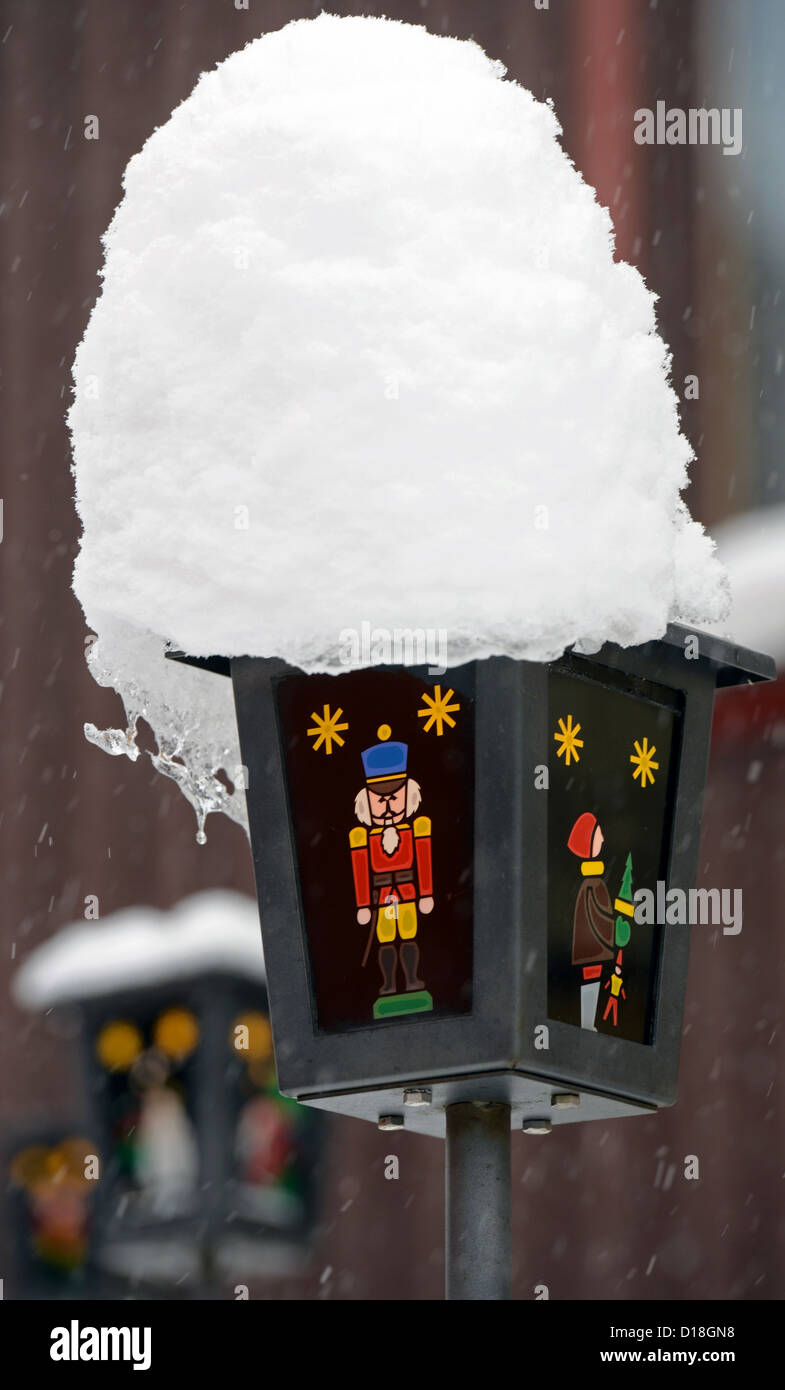 A street light is covered in snow in the Arch mountains toy village of ...
