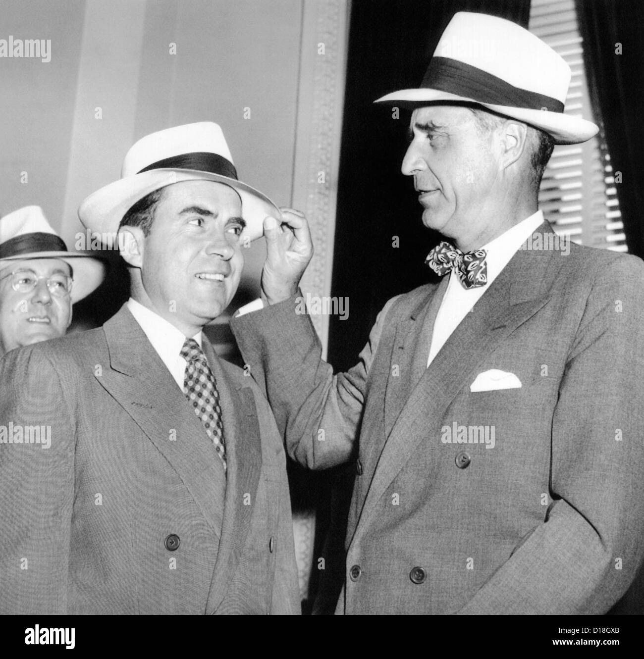 Senator Prescott Bush presents a new straw hat to Vice President ...