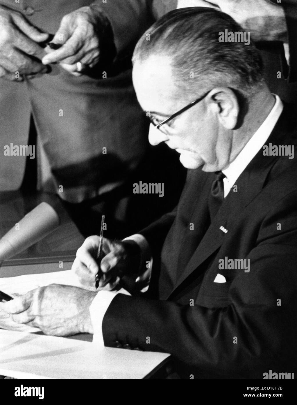 President Lyndon Johnson signing the 1964 Civil Rights bill. July 2 ...