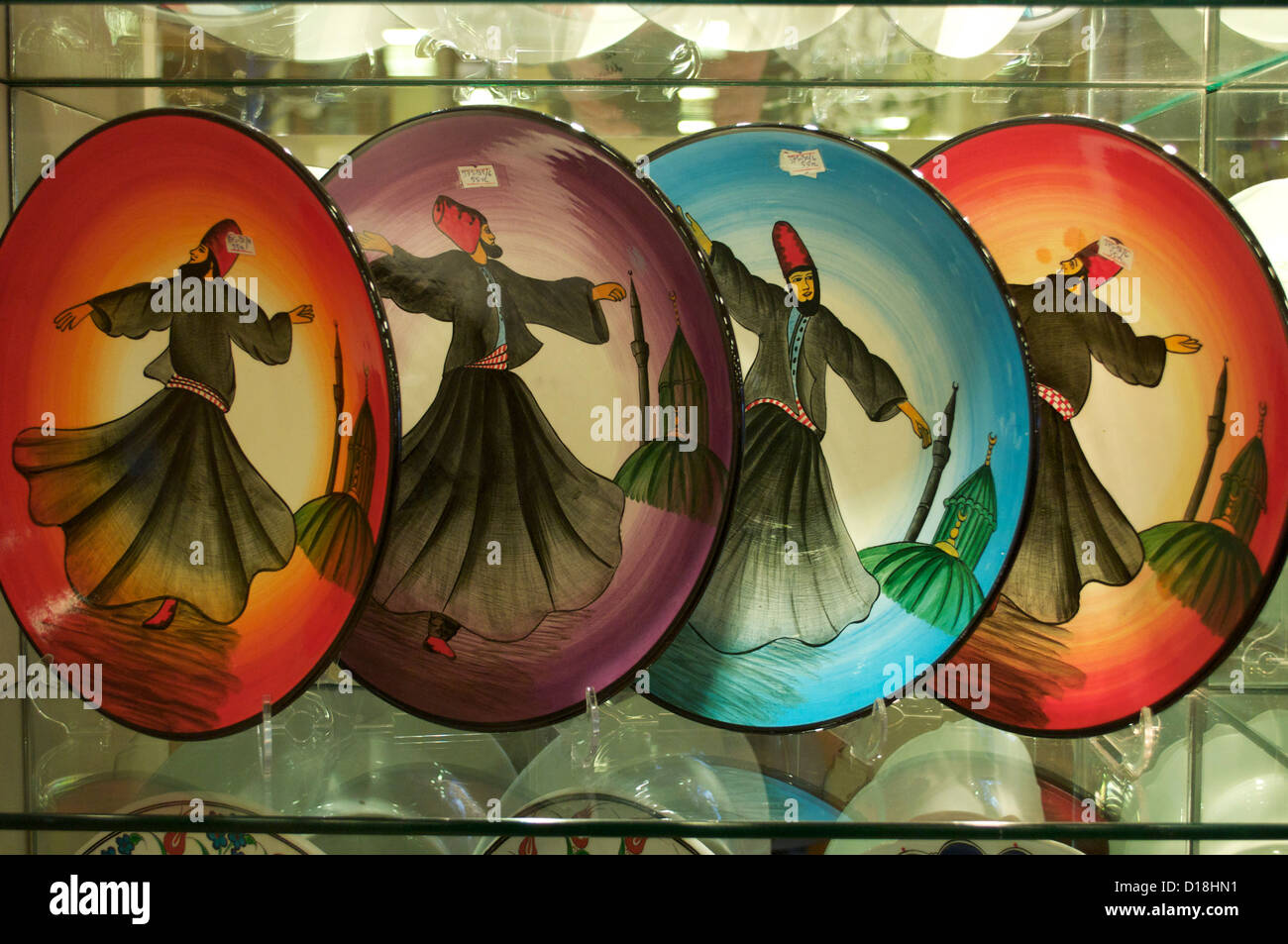 Colourful plates depicting dancing dervishes in a craft shop in ...
