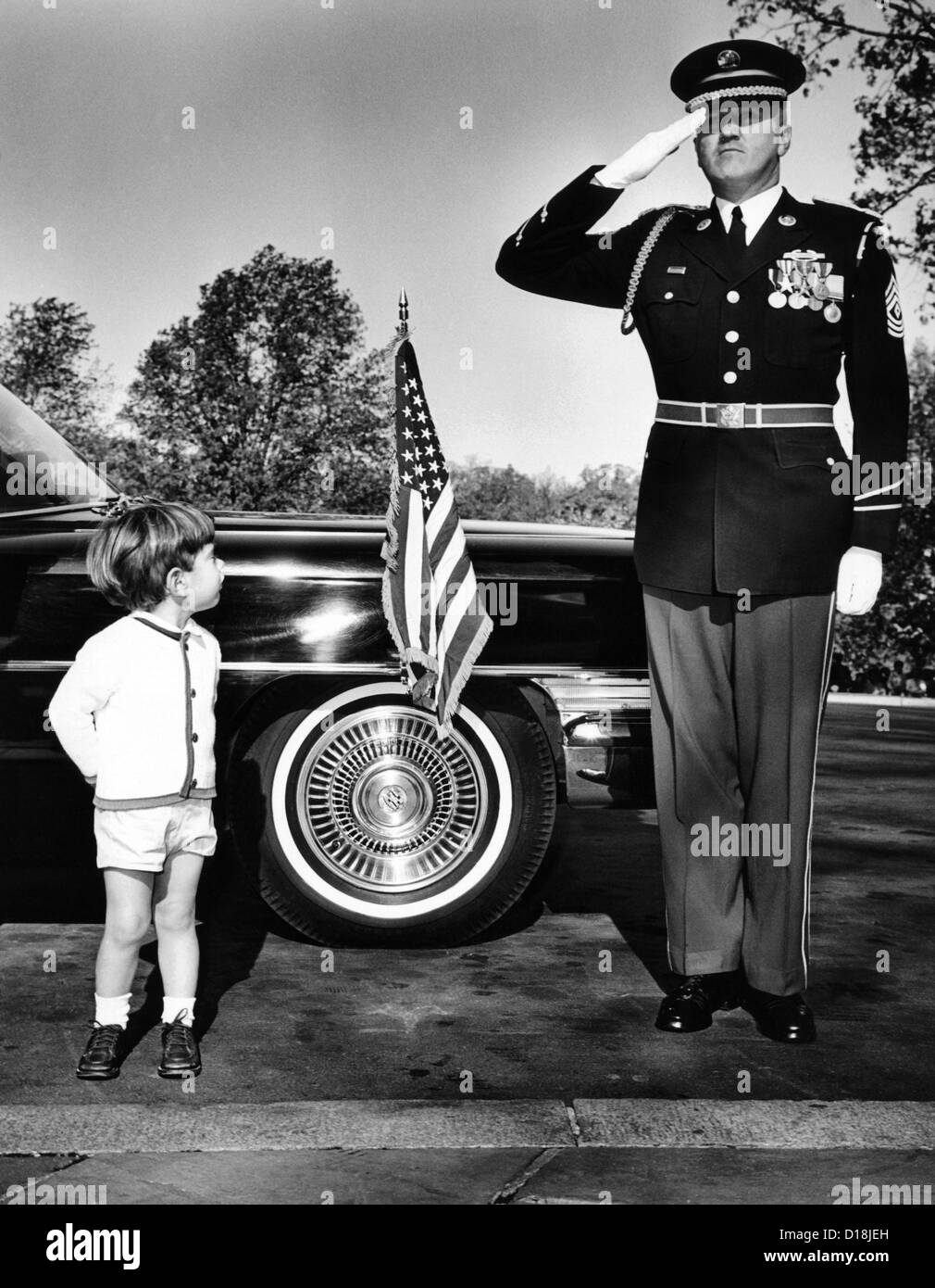 John F. Kennedy Jr. look up at Sgt. Eldon J. Johnston, during Veteran's ...