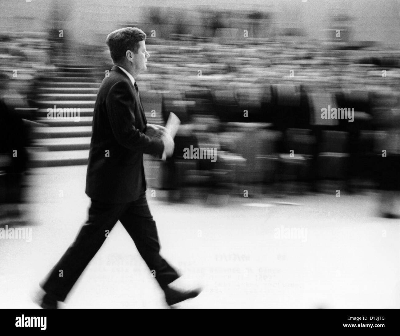 President John Kennedy walking fast after a press conference in the ...