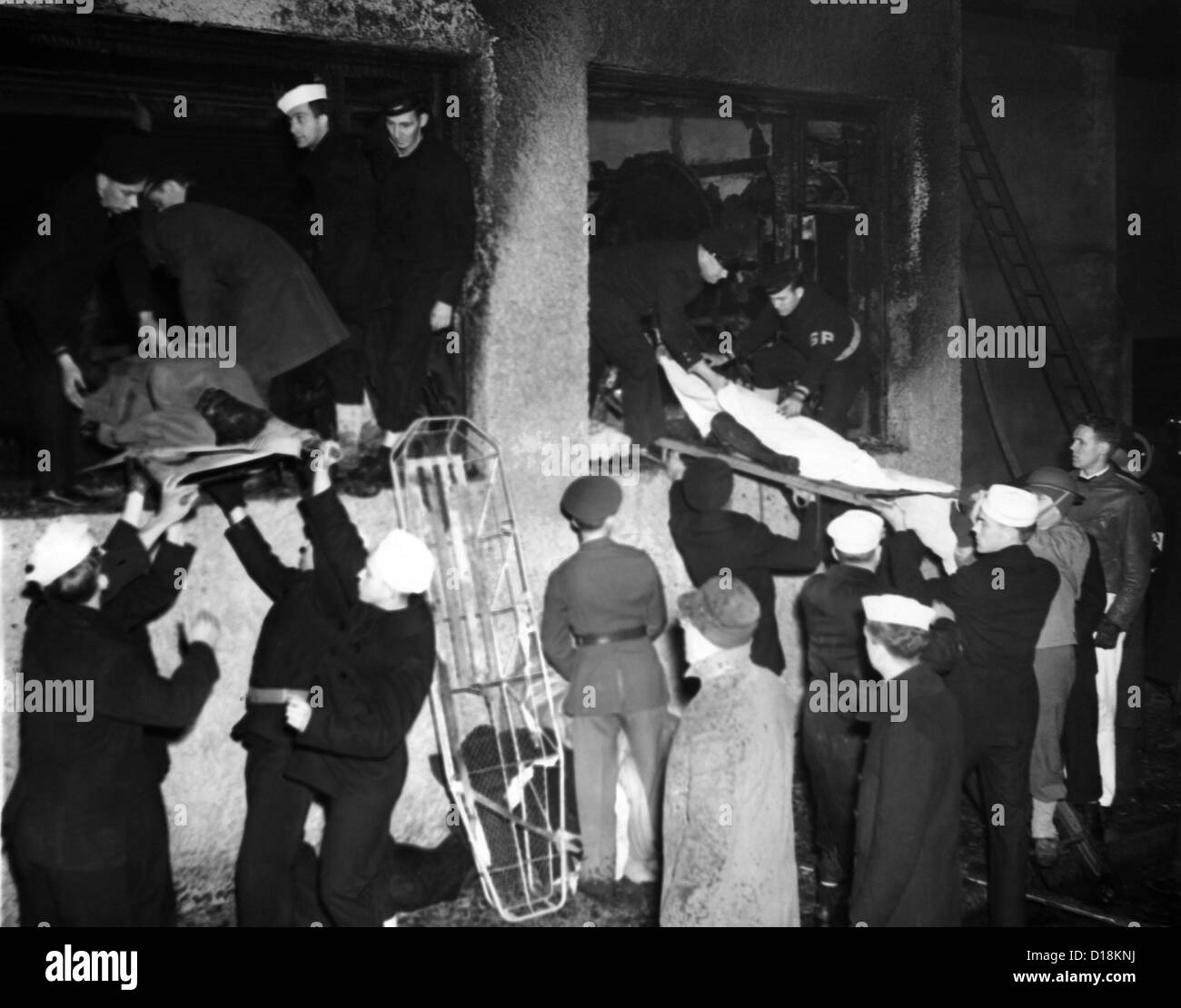 Coconut Grove Nightclub Fire. Service men assist in the removal of ...