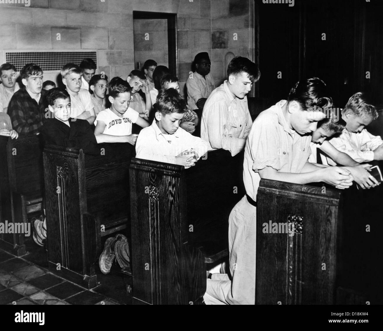 Boys Town citizens bow their heads in prayer for the Father Flanagan ...