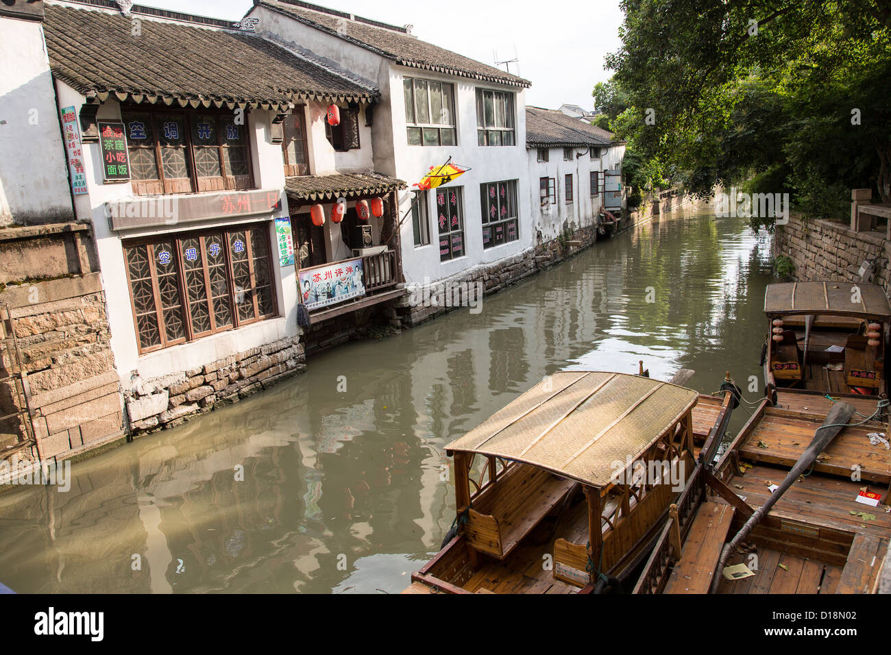 Boats and gondolas along a canal at Pingjiang Road in Suzhou, China ...