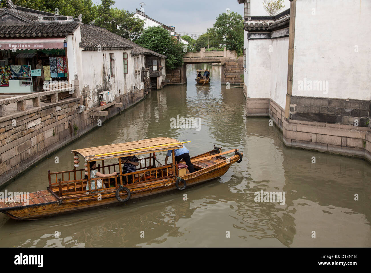 Boats and gondolas along a canal at Pingjiang Road in Suzhou, China ...