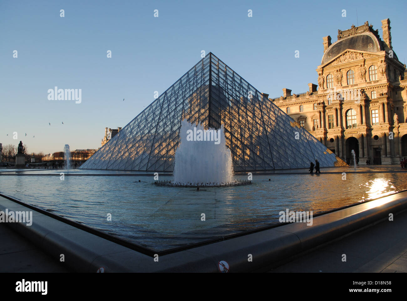 Louvre pyramid sunset hi-res stock photography and images - Alamy
