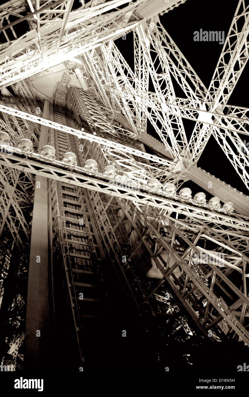The Eiffel tower from the bottom with the lights highlighting the ...