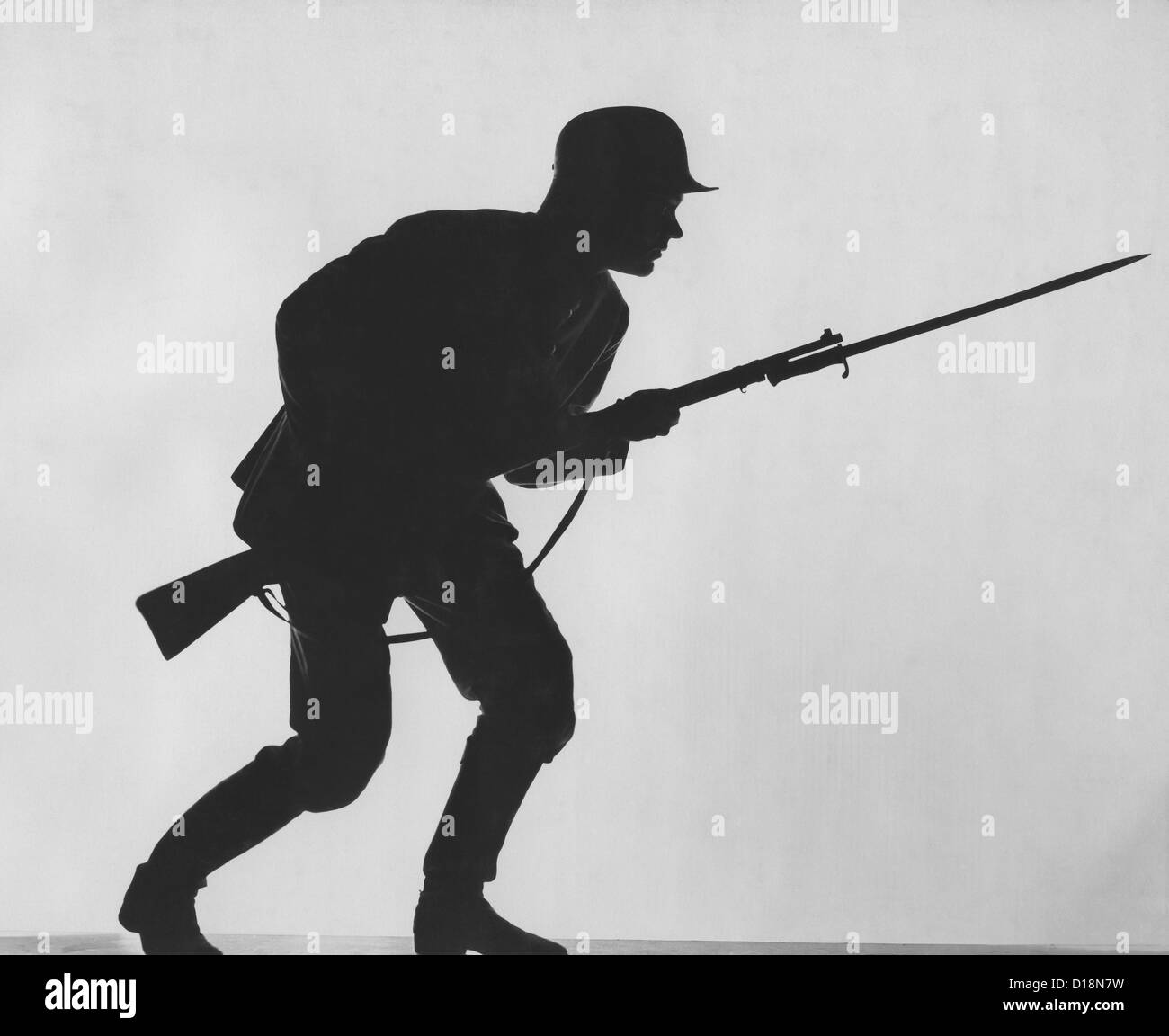 Soldier holding rifle military Black and White Stock Photos & Images ...