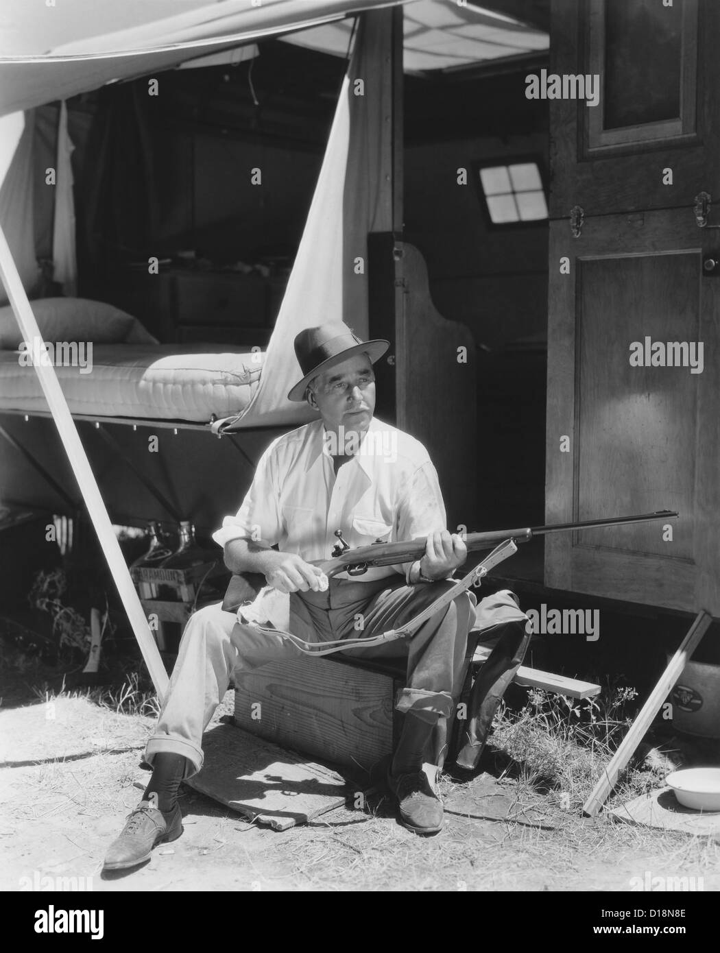 Mature hunter holding rifle Black and White Stock Photos & Images - Alamy