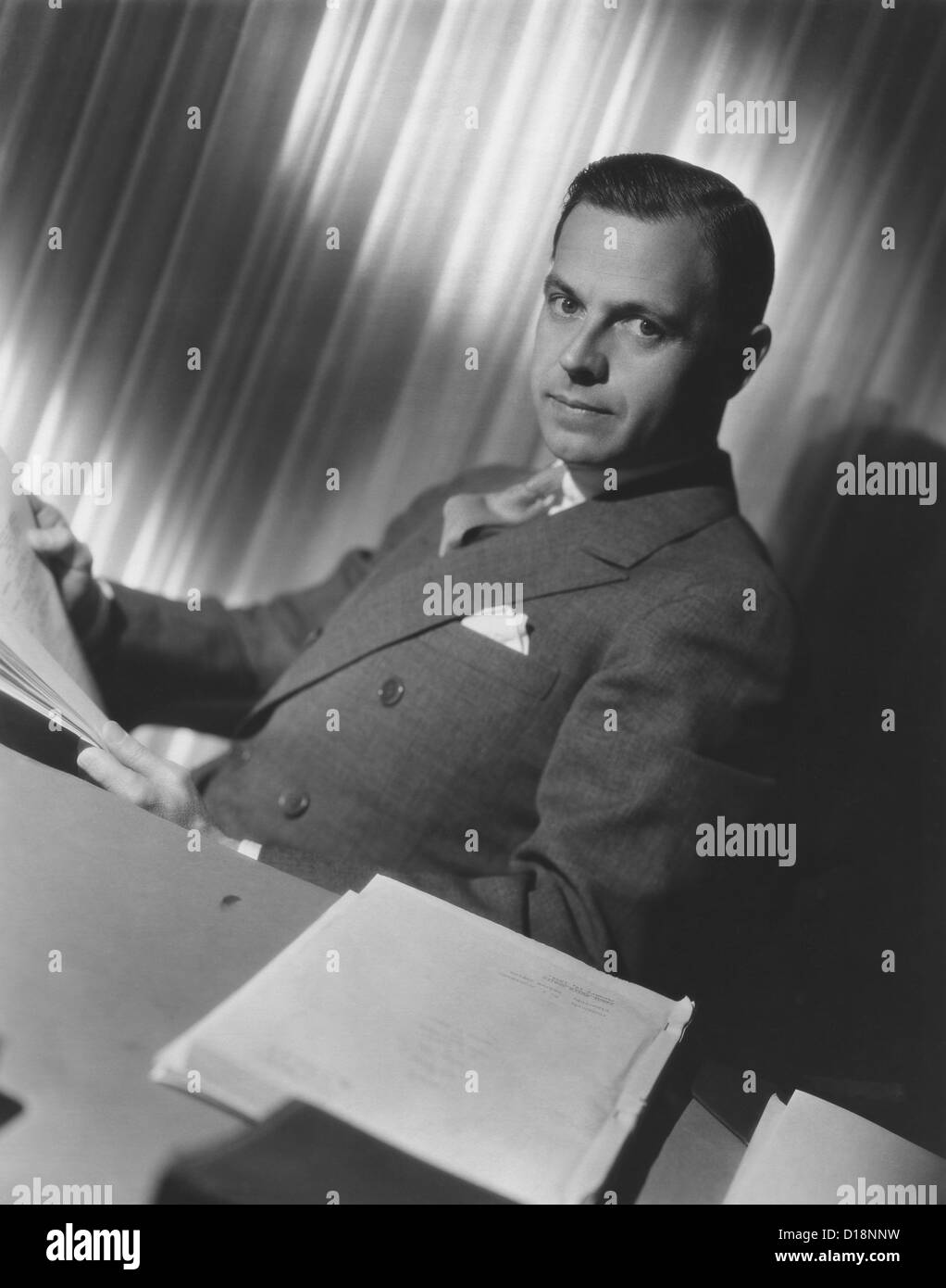 Sitting looking at camera authority holding place of work hi-res stock ...