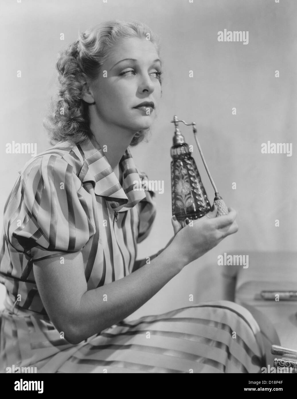 Woman spray perfume Black and White Stock Photos & Images - Alamy