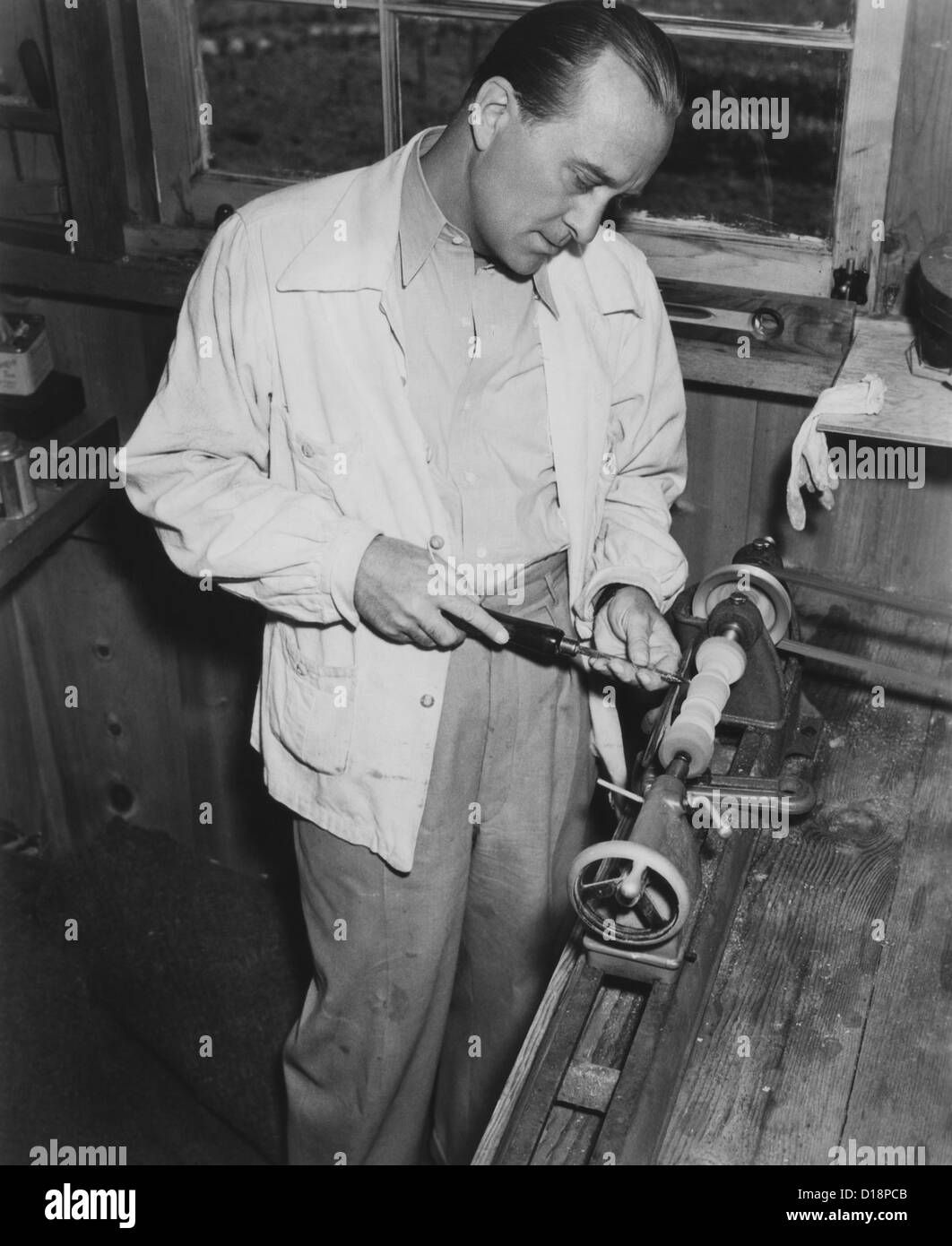 Toiling in workshop Stock Photo - Alamy