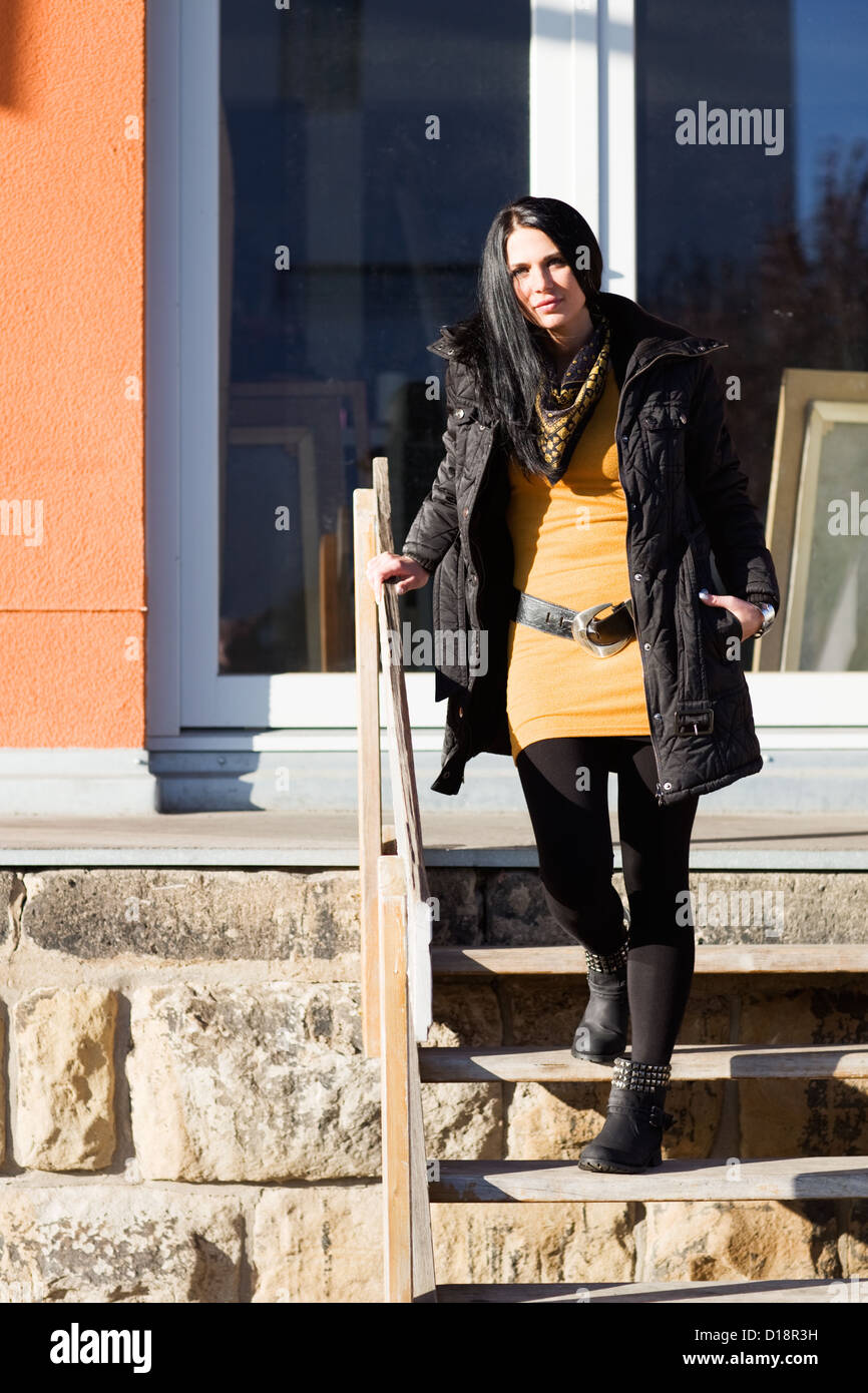 Woman building entrance in front hi-res stock photography and images ...