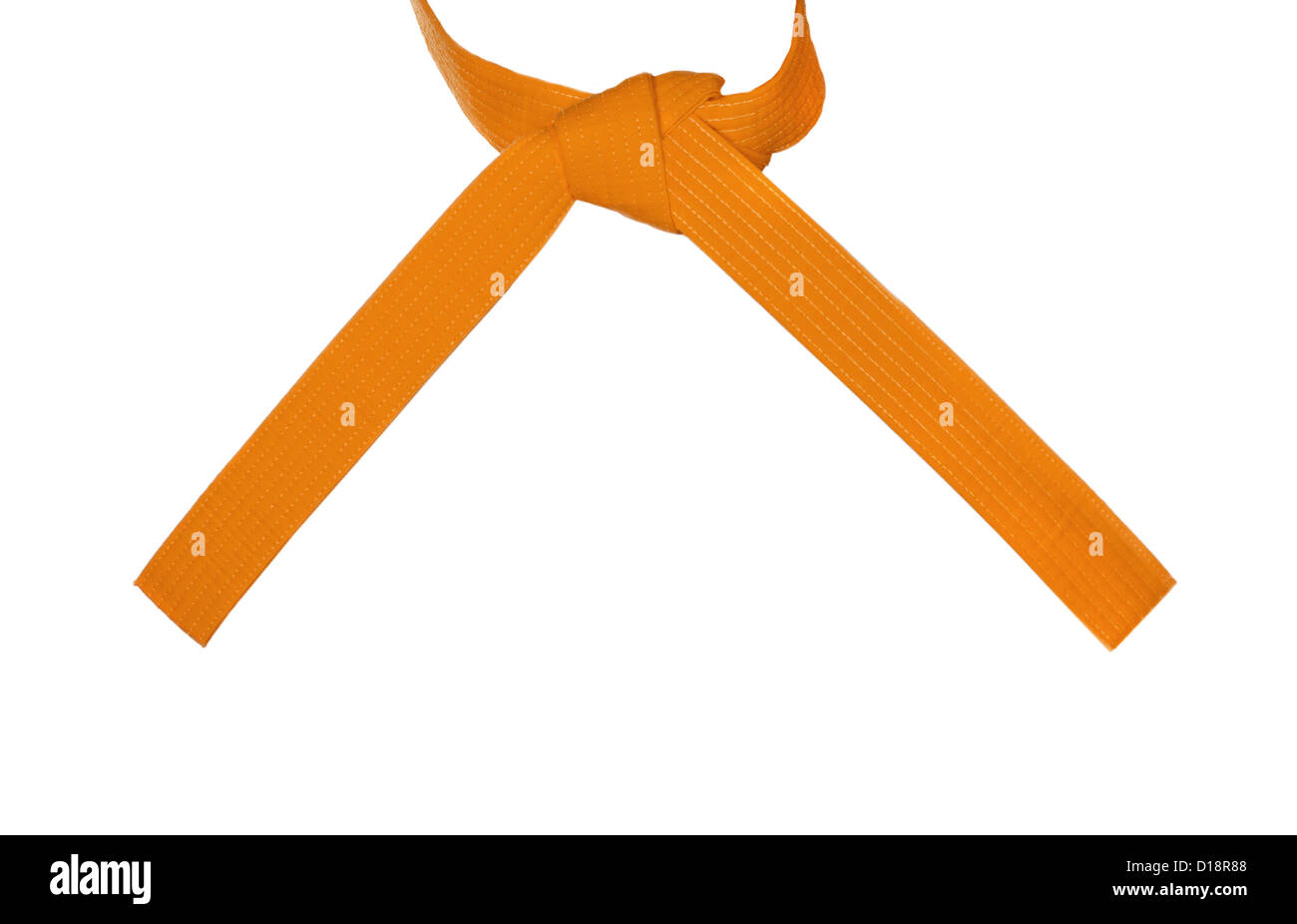 Karate orange belt tied tied in a knot Stock Photo - Alamy