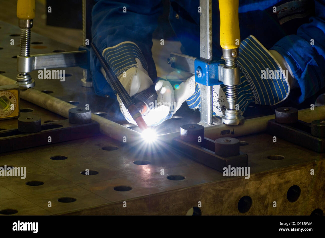 Man welding workpiece hi-res stock photography and images - Alamy