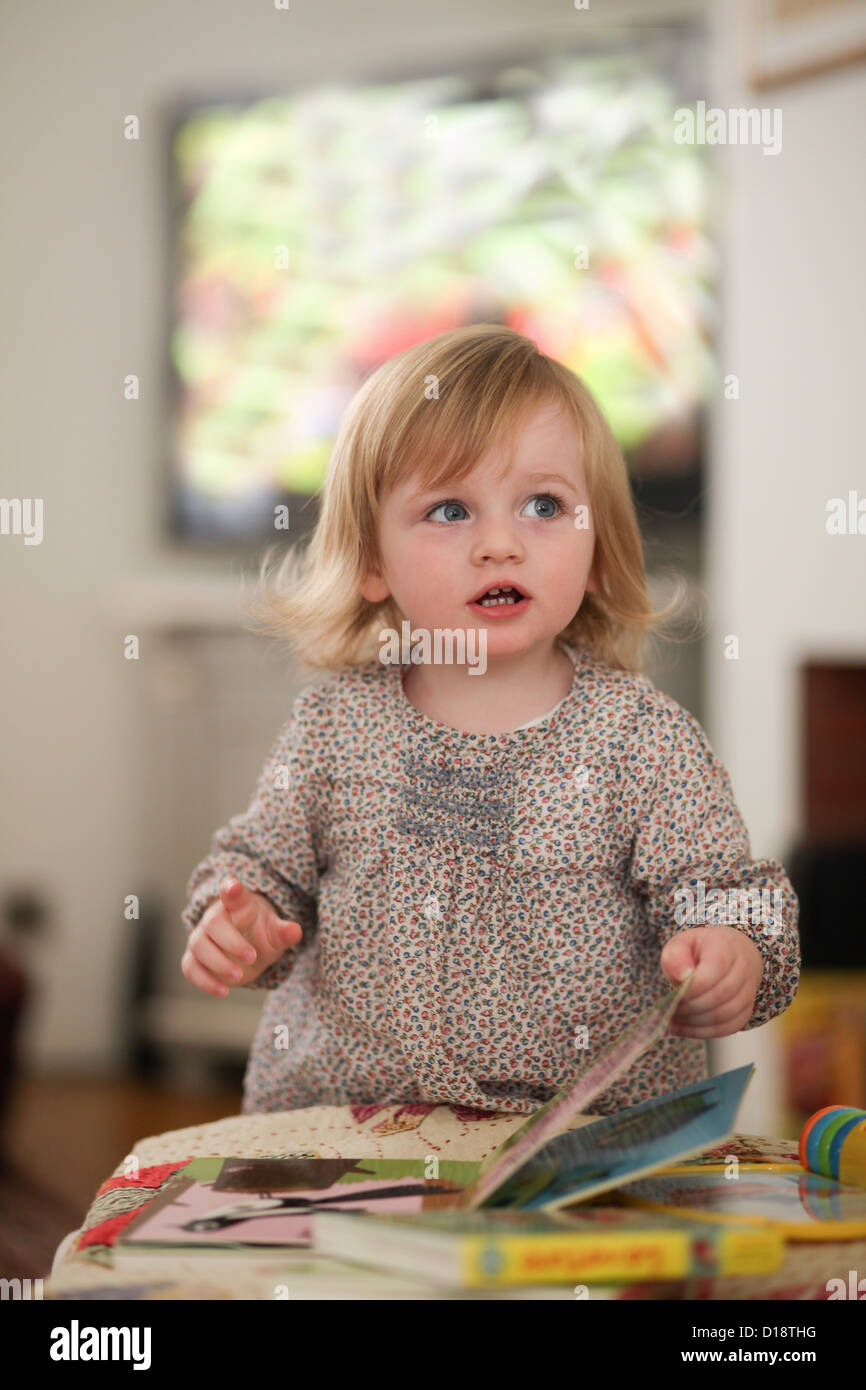 Portrait of toddler with books Stock Photo - Alamy