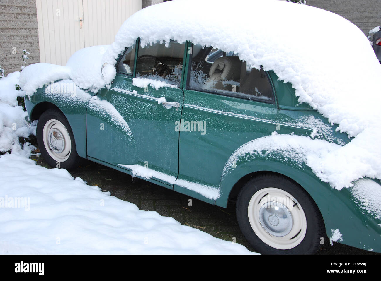 snow covered Morris Minor on driveway Stock Photo - Alamy