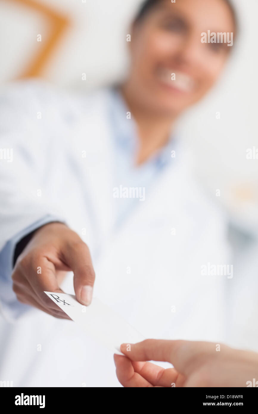 Smiling pharmacist giving Rx prescription to a customer Stock Photo - Alamy