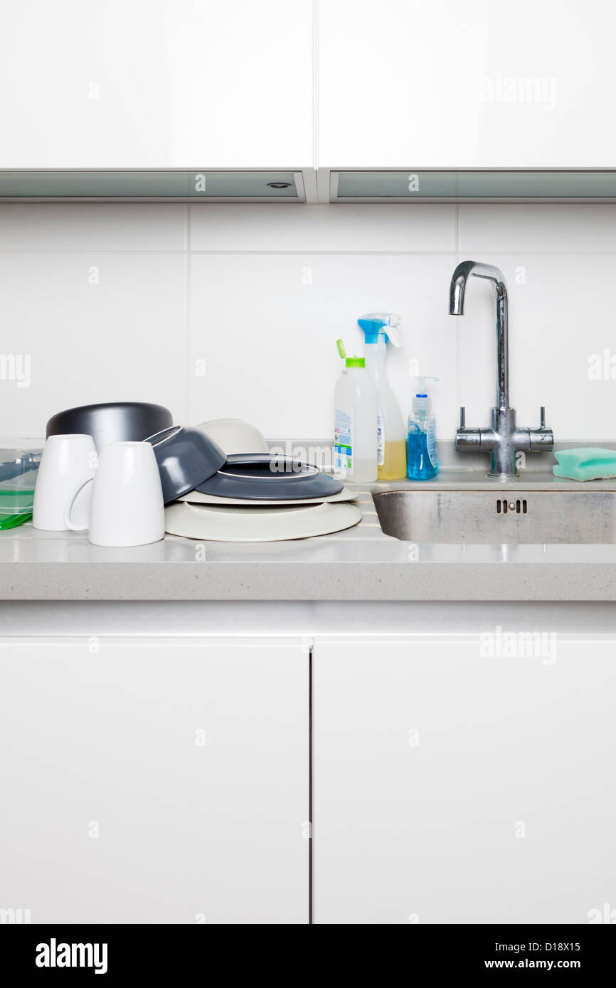 Washing up on kitchen sink Stock Photo - Alamy