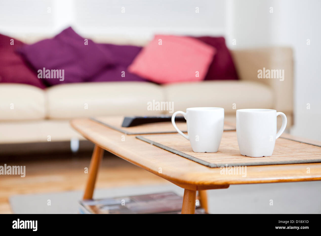 Two coffee cups on coffee table Stock Photo - Alamy