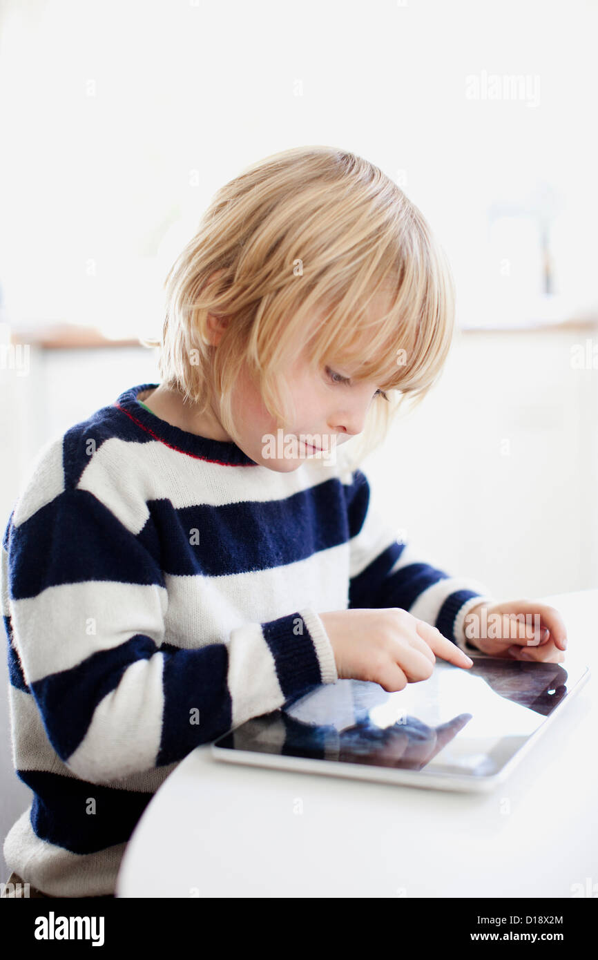 Boy using digital tablet Stock Photo - Alamy