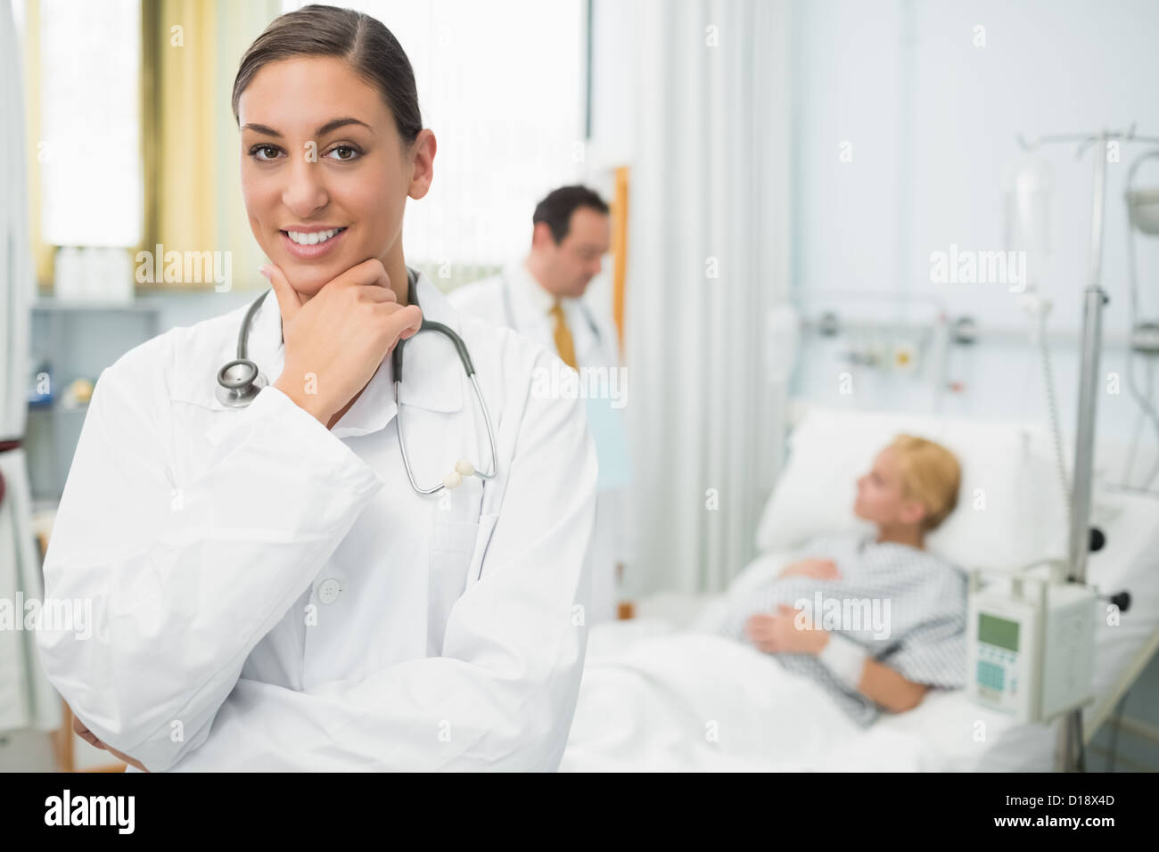 Female doctor folding arms hi-res stock photography and images - Alamy