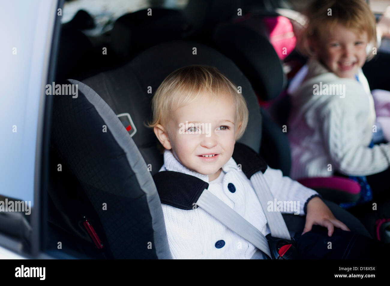 Brother and sister in car Stock Photo - Alamy