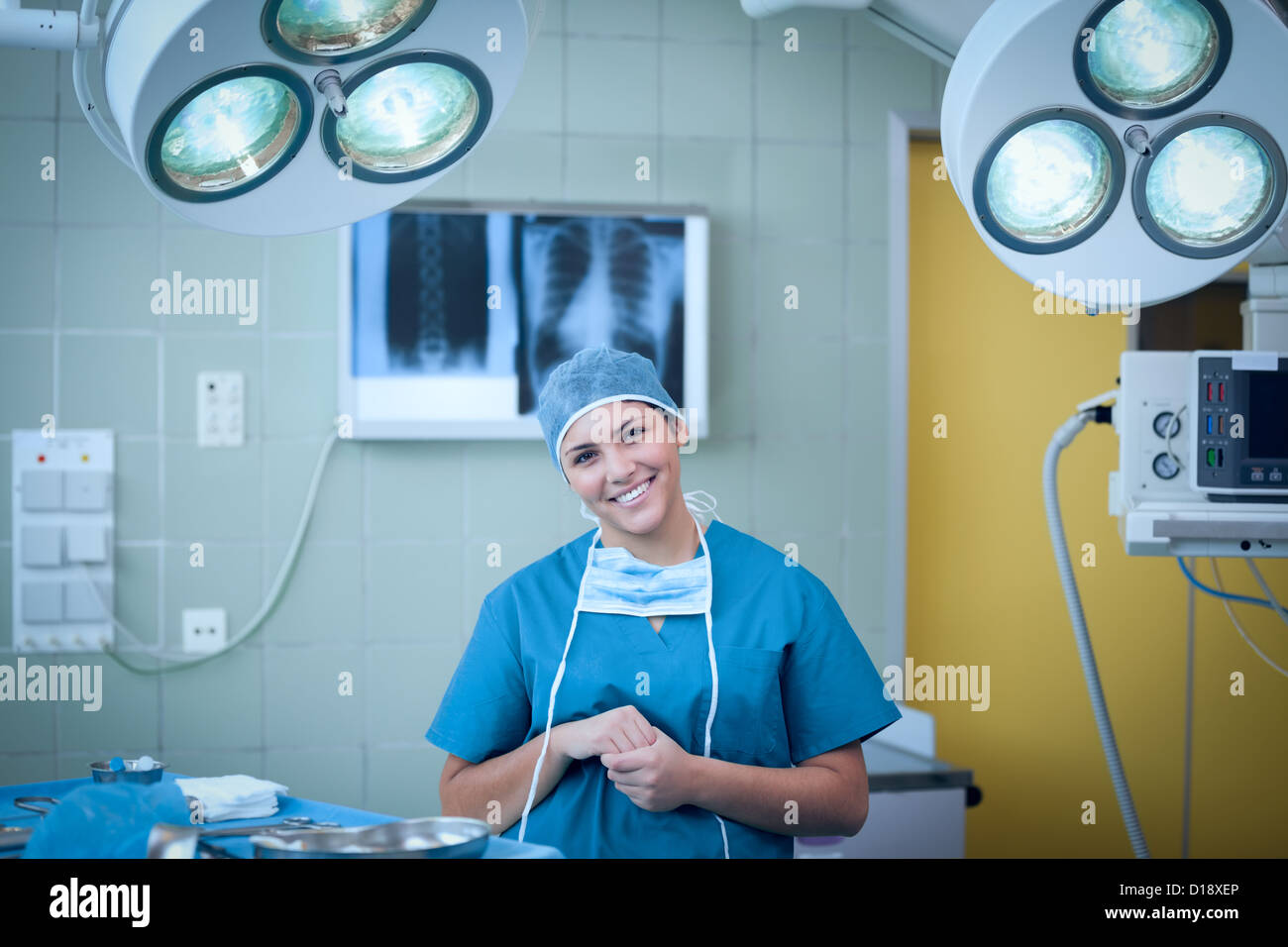 Smiling surgeon under surgical light Stock Photo - Alamy