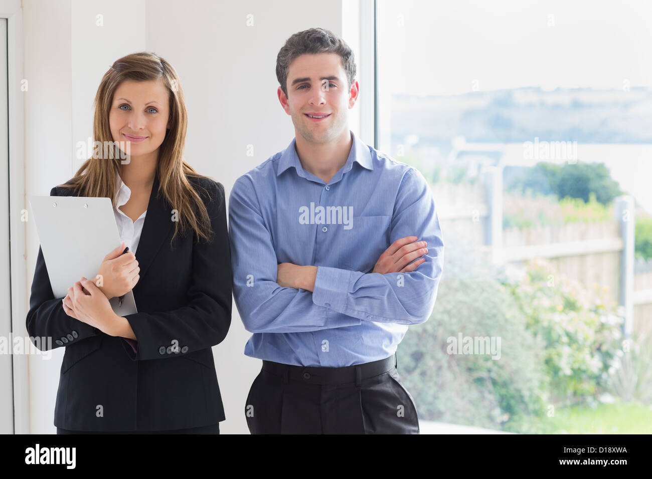 Estate agent and client Stock Photo - Alamy