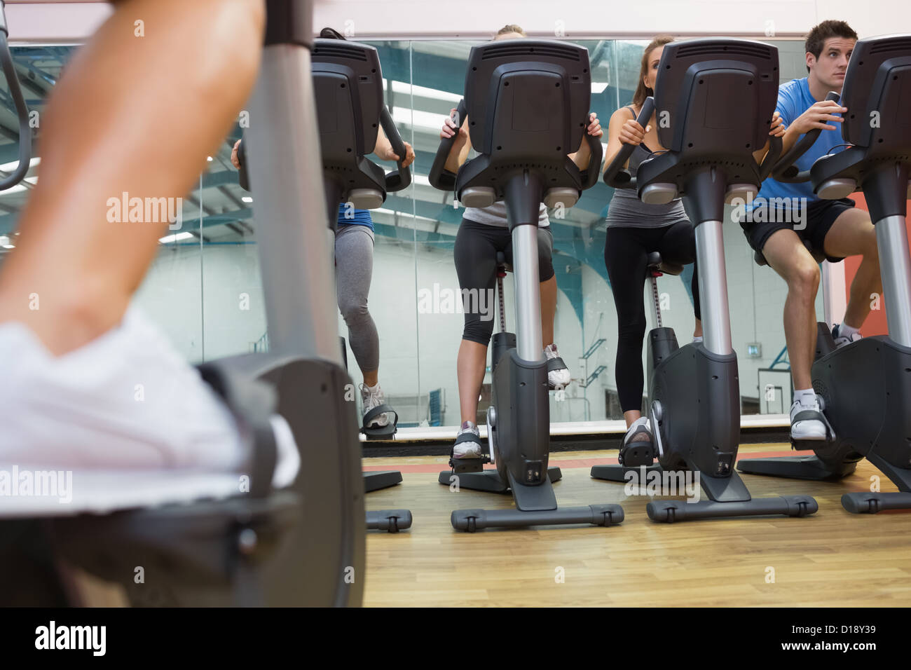 People taking a spinning class Stock Photo - Alamy
