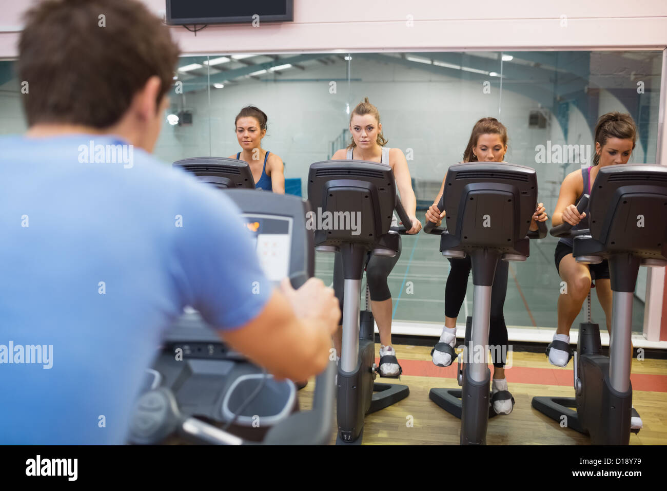 Man instructs spinning class Stock Photo - Alamy