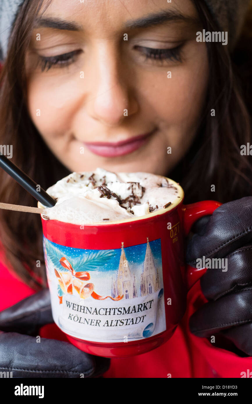 Woman drinking hot chocolate at Christmas market in Cologne Germany ...