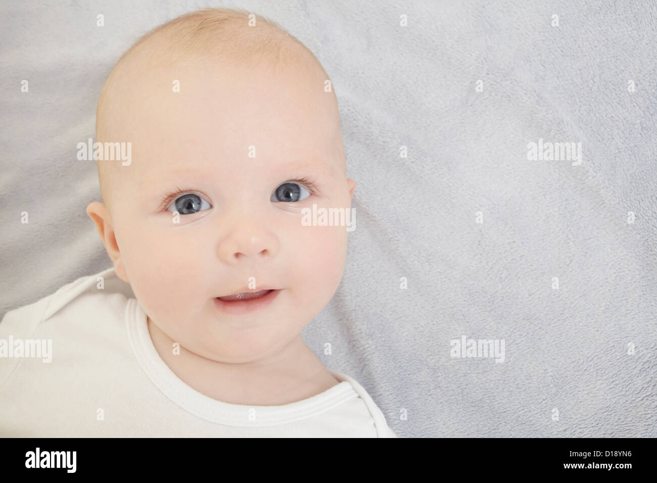 Portrait of newborn baby looking at camera Stock Photo - Alamy