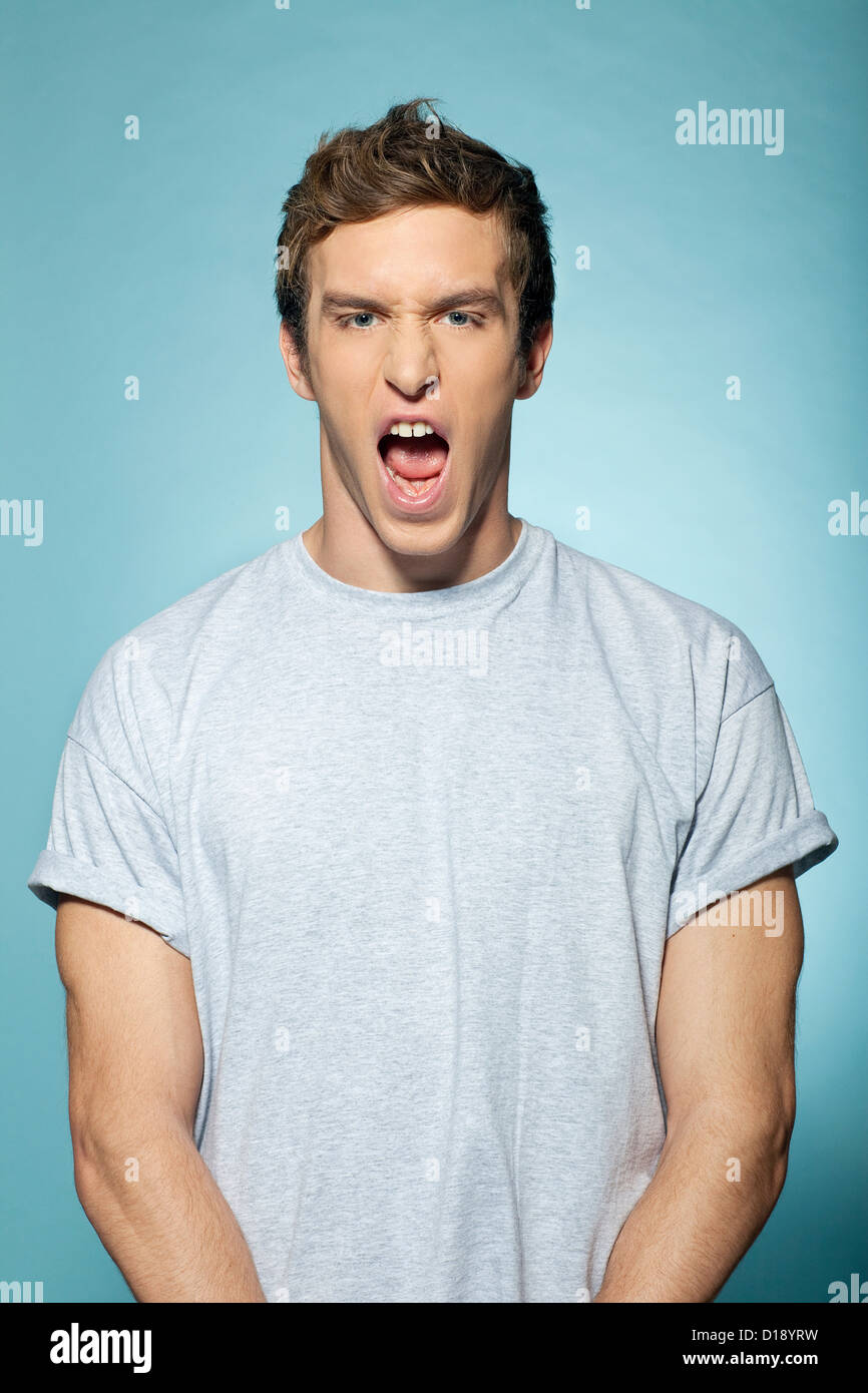 Man pulling faces Stock Photo - Alamy