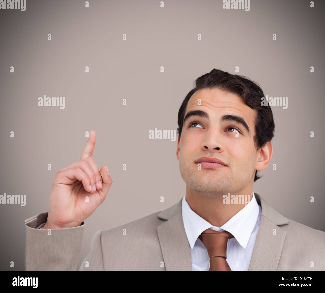 Man thinking and pointing Stock Photo - Alamy