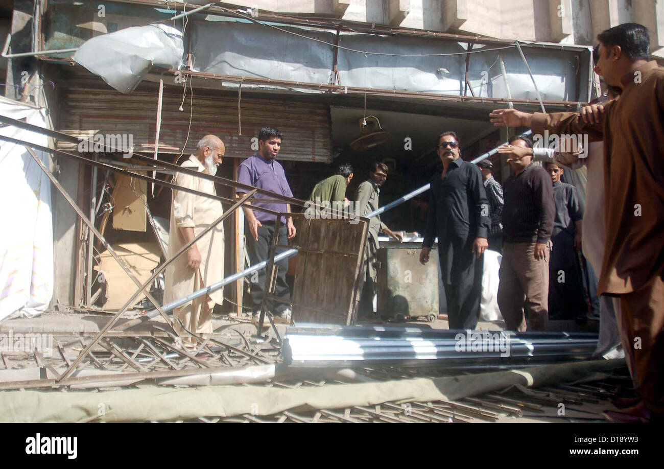 People gather near shop after hand grenade attack by extortion mafia ...