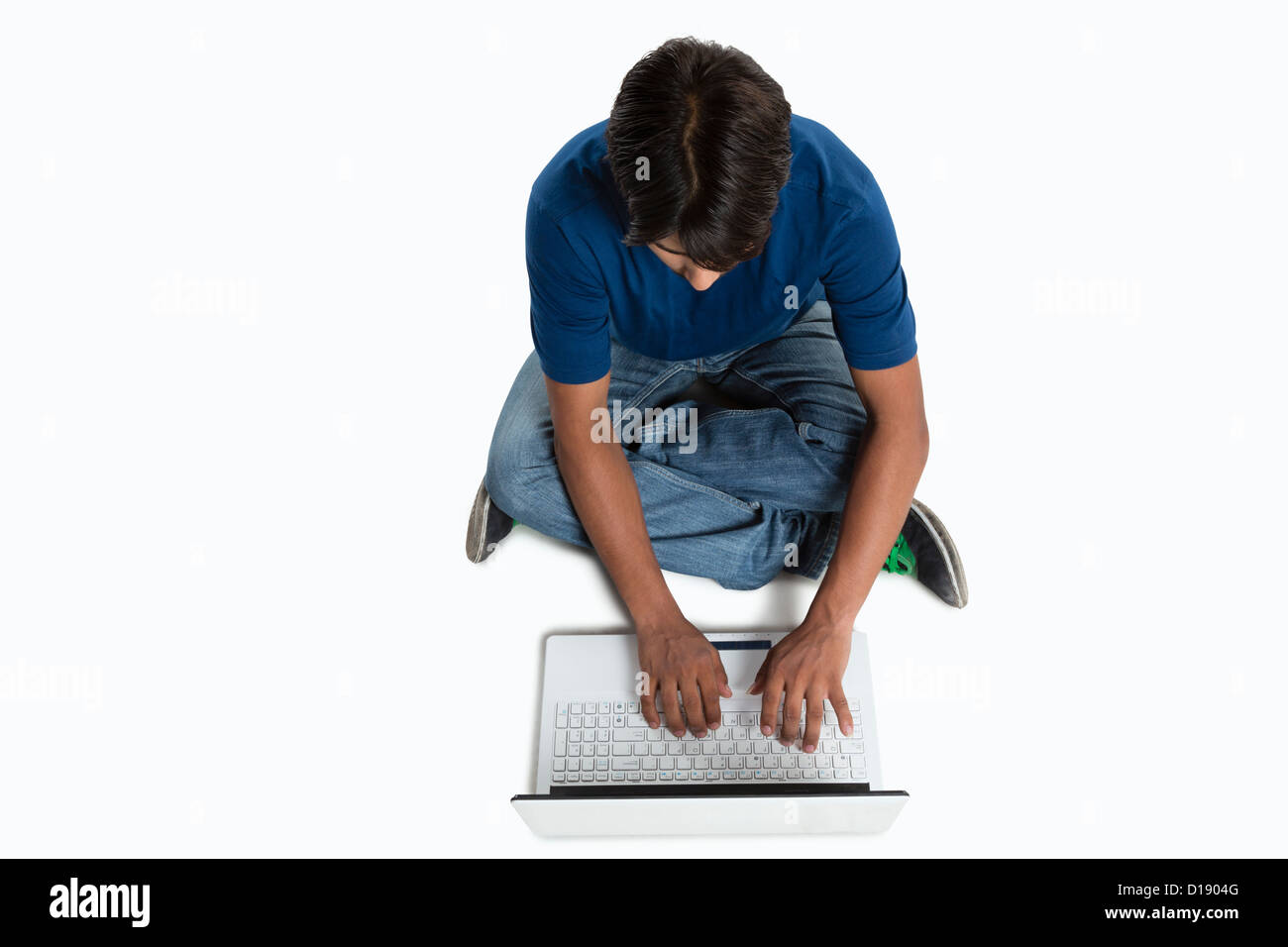 Indian man home laptop working Cut Out Stock Images & Pictures - Alamy