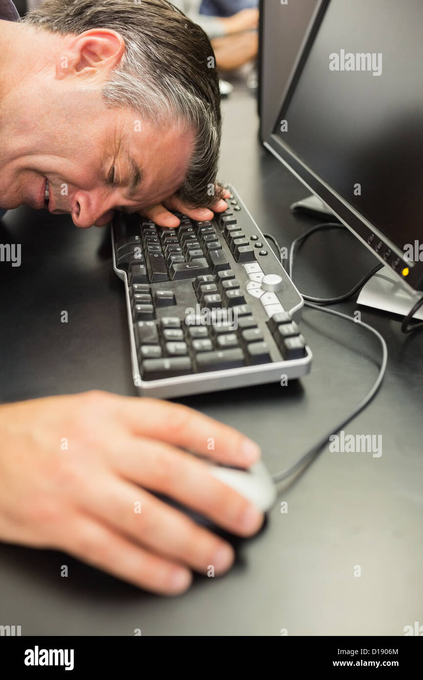 Man asleep on keyboard Stock Photo - Alamy