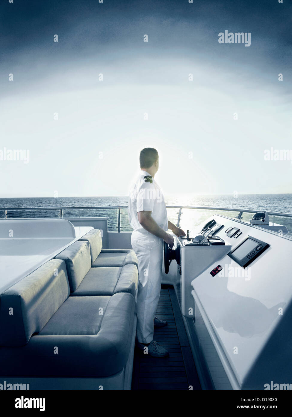 Captain at helm of large motor yacht Stock Photo - Alamy