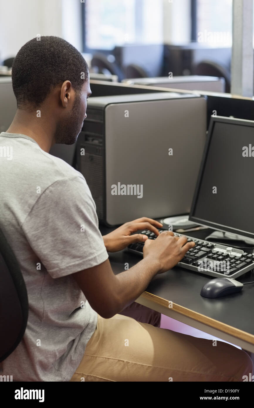 Man sitting at the computer Stock Photo - Alamy