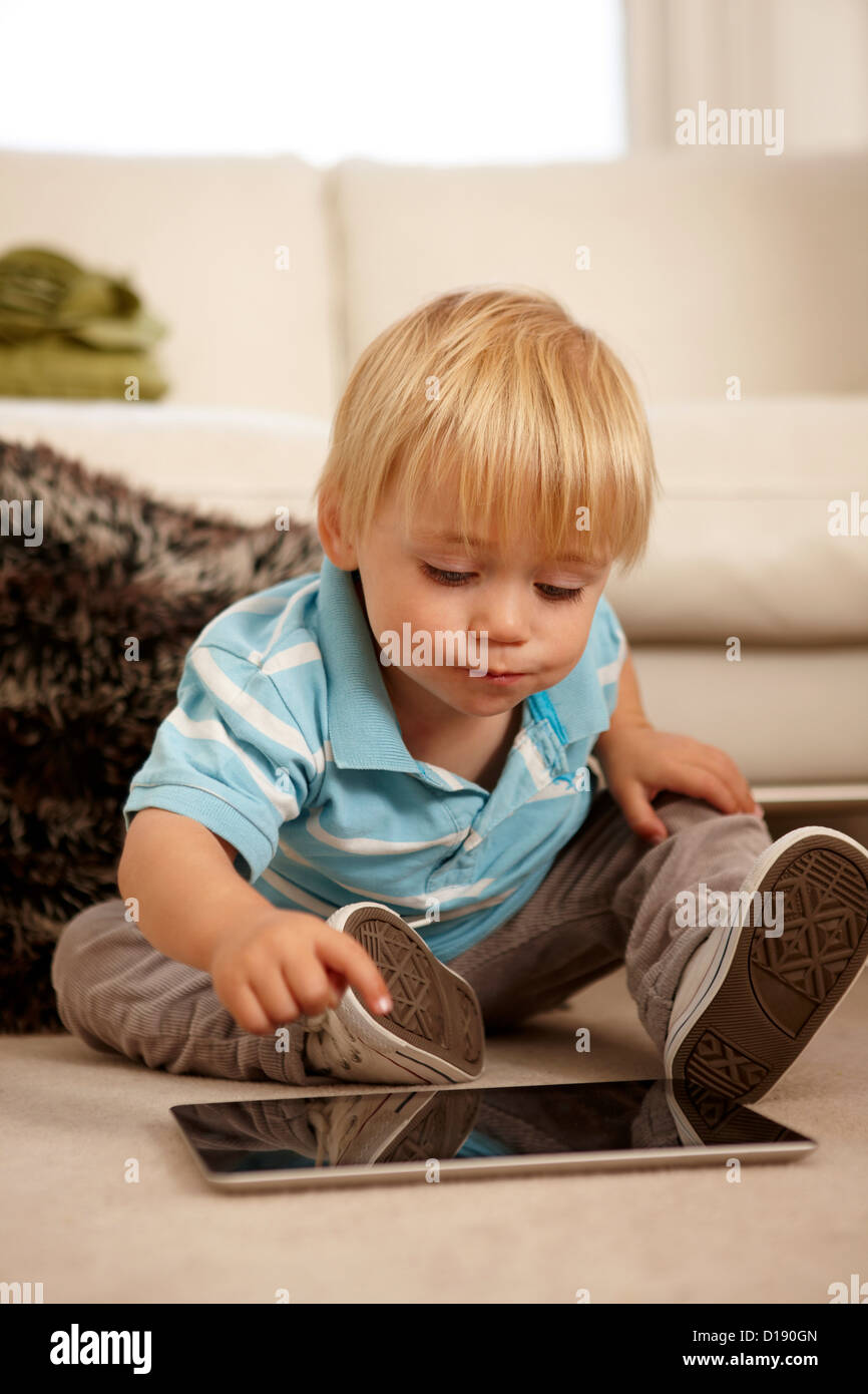 Boy using digital tablet Stock Photo - Alamy