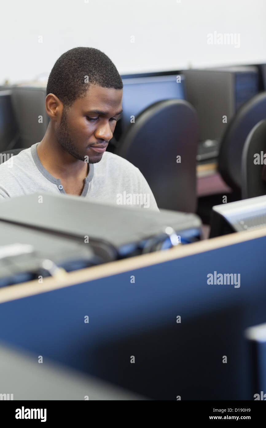 Man sitting at computer desk Stock Photo - Alamy