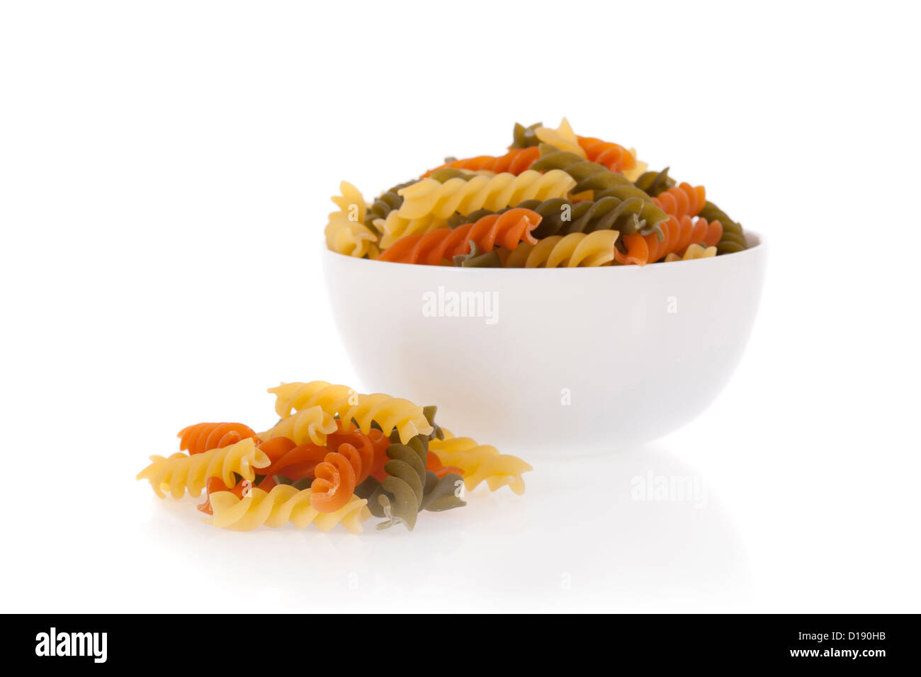 Tricolore fusilli pasta in a bowl isolated on a white background Stock ...