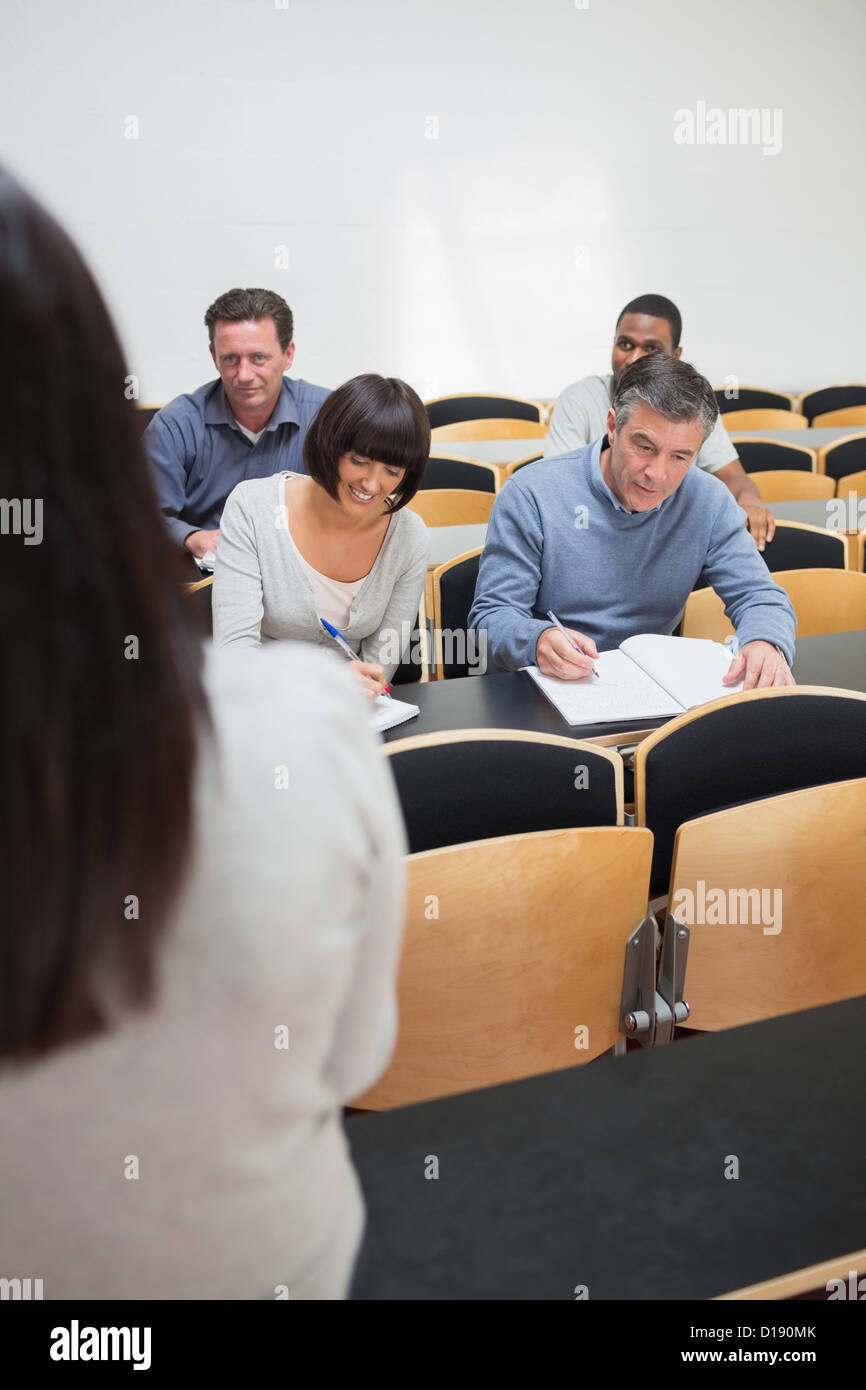 People taking notes in a lecture Stock Photo - Alamy
