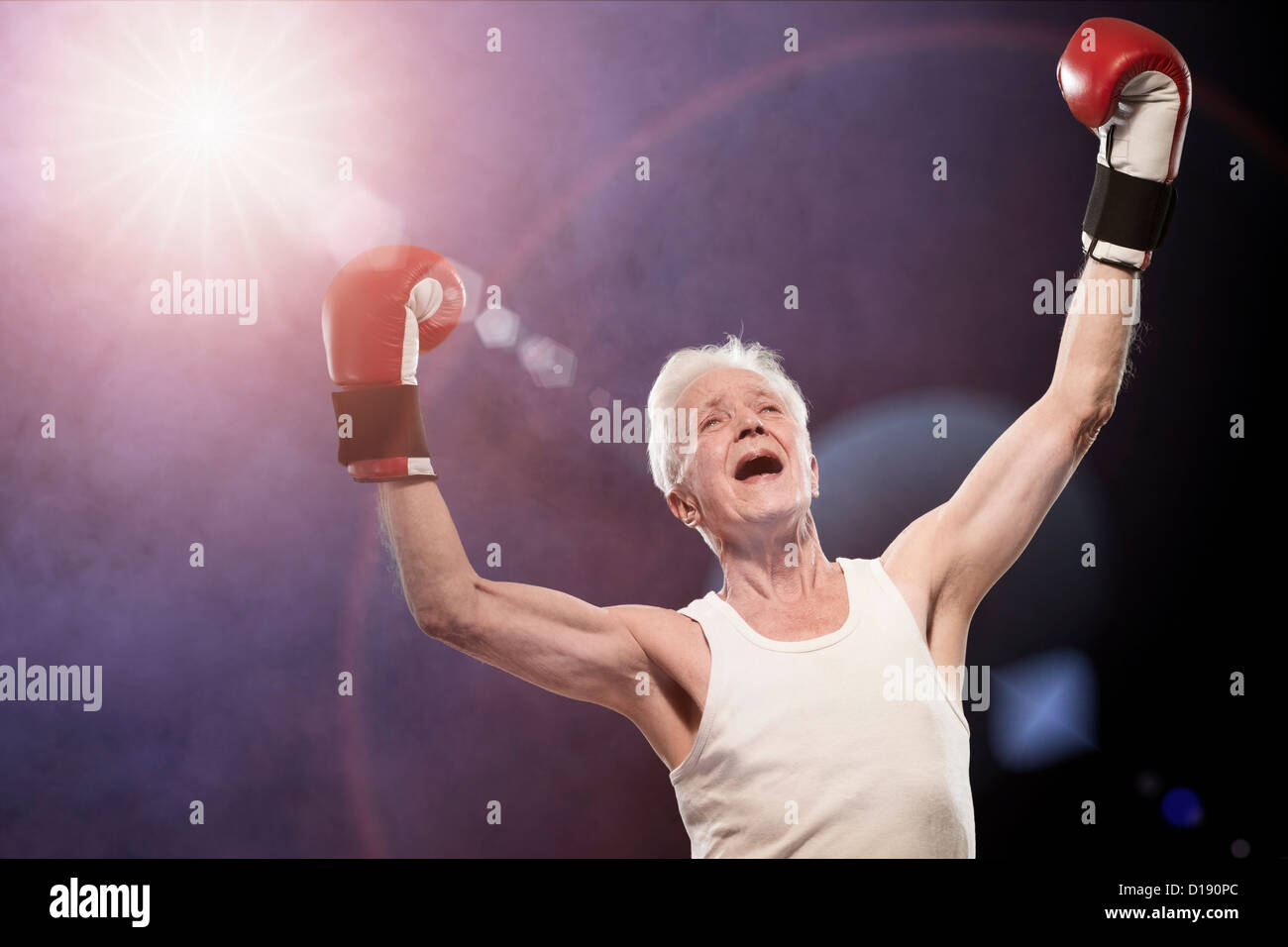 Senior male boxer cheering Stock Photo - Alamy